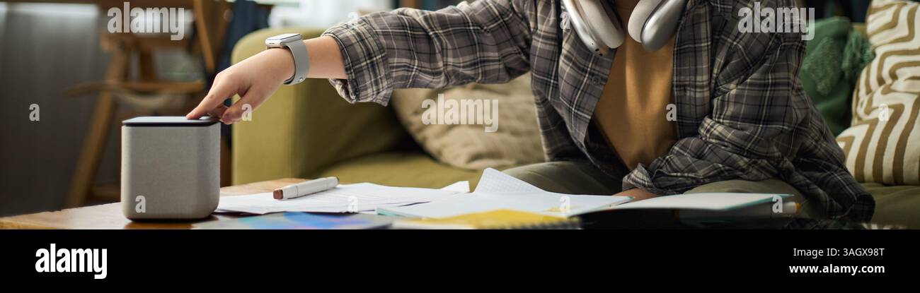 Using Portable Speaker in Comfortable Home Setting Stock Photo - Alamy