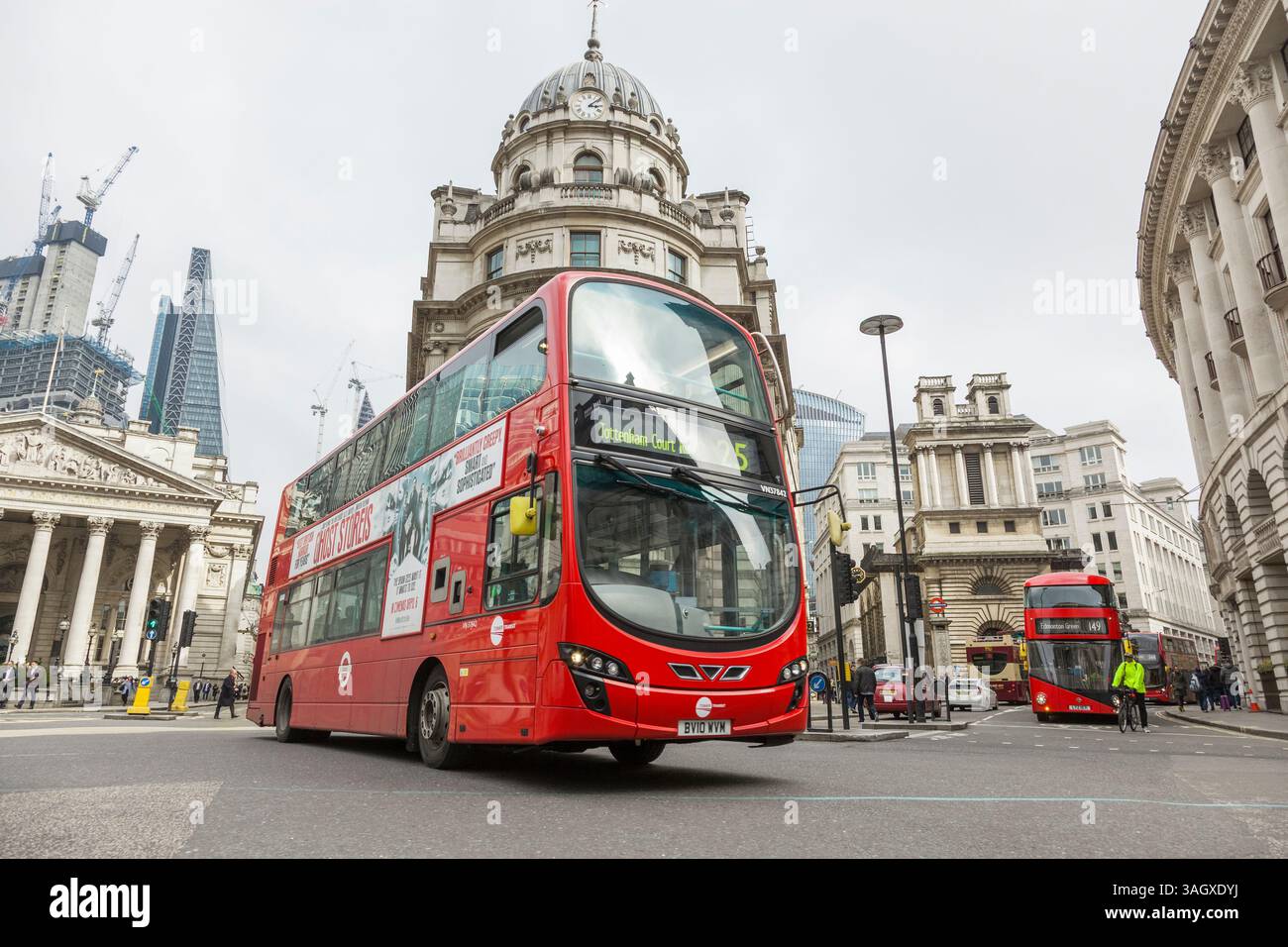 Double decker London bus in the city's financial district Stock Photo ...
