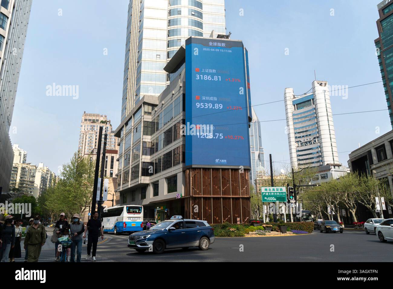A screen shows major Chinese stock index on a building in Shanghai ...