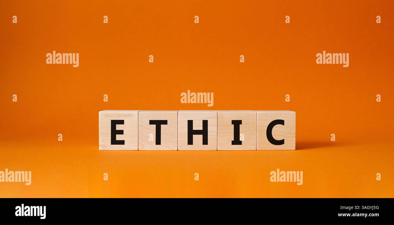 Ethic symbol. Wooden cubes with word Ethic. Beautiful orange background ...
