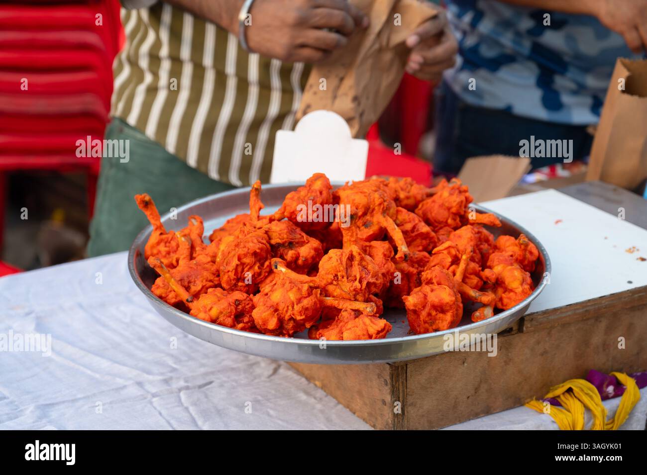 Chicken Lollipop or drumstick marinated and fried with spices, street ...