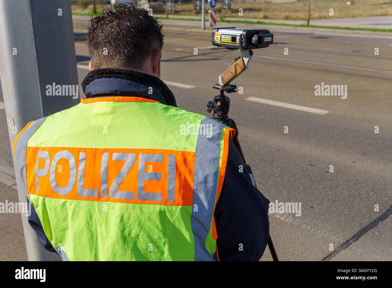 Augsburg, Bavaria, Germany - April 9, 2025: Police officer monitors ...