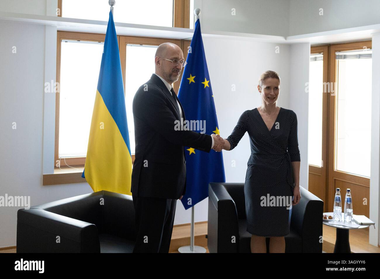 European Union foreign policy chief Kaja Kallas, right, shakes hands ...