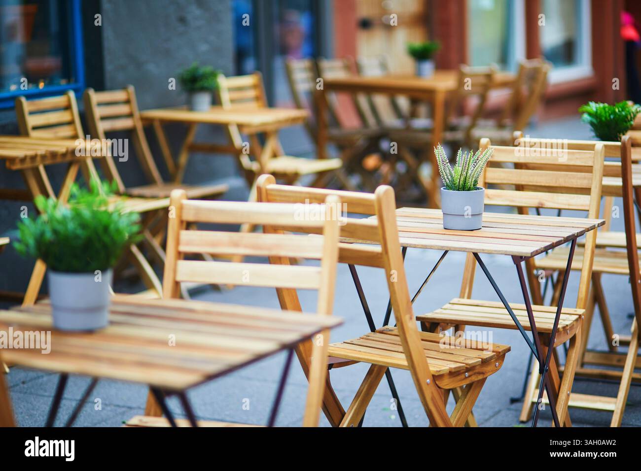 Empty wooden table of an outdoor cafe in Reykjavik, Iceland Stock Photo ...