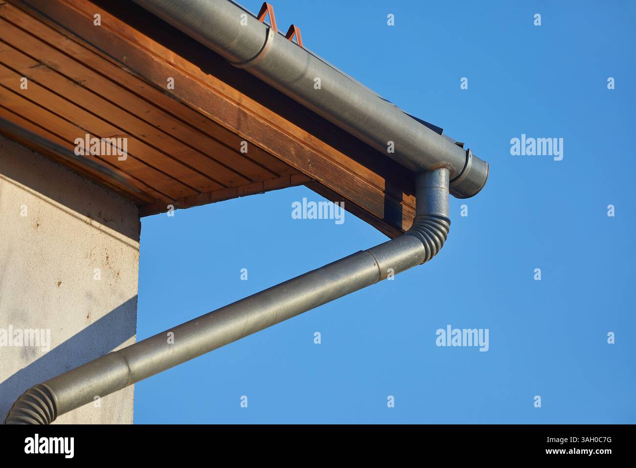 Gutter pipe eaves trough of a house Stock Photo - Alamy