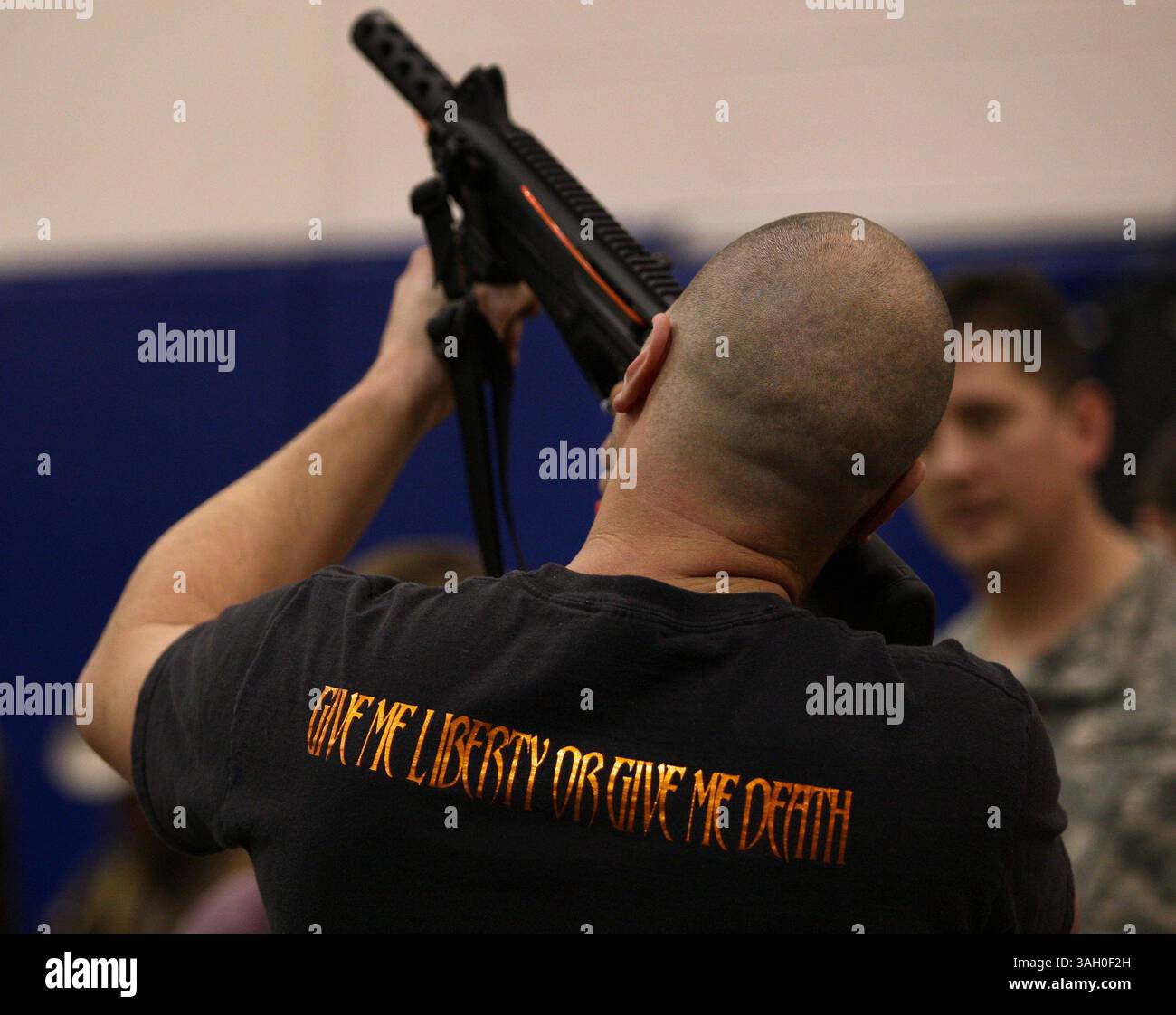 John Wagner/News-Miner.Far North Tactical's Aaron Bennett demonstrates ...