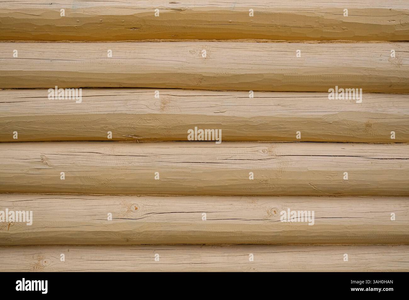 High-resolution texture of a wooden log wall with natural patterns and ...