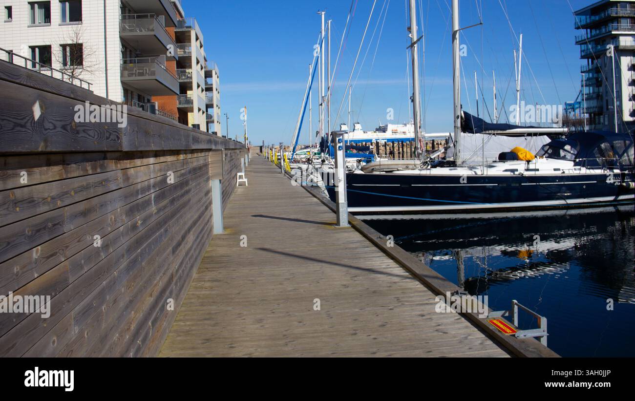 Sailing port dock in Malmo city with boats docked along the waterfront ...
