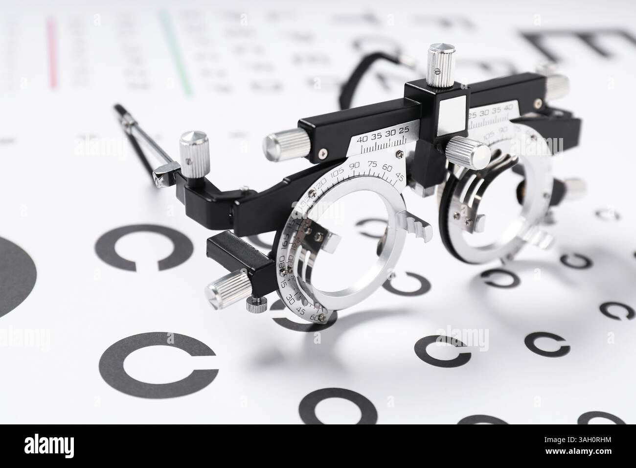 Trial frame on vision test chart, closeup Stock Photo - Alamy