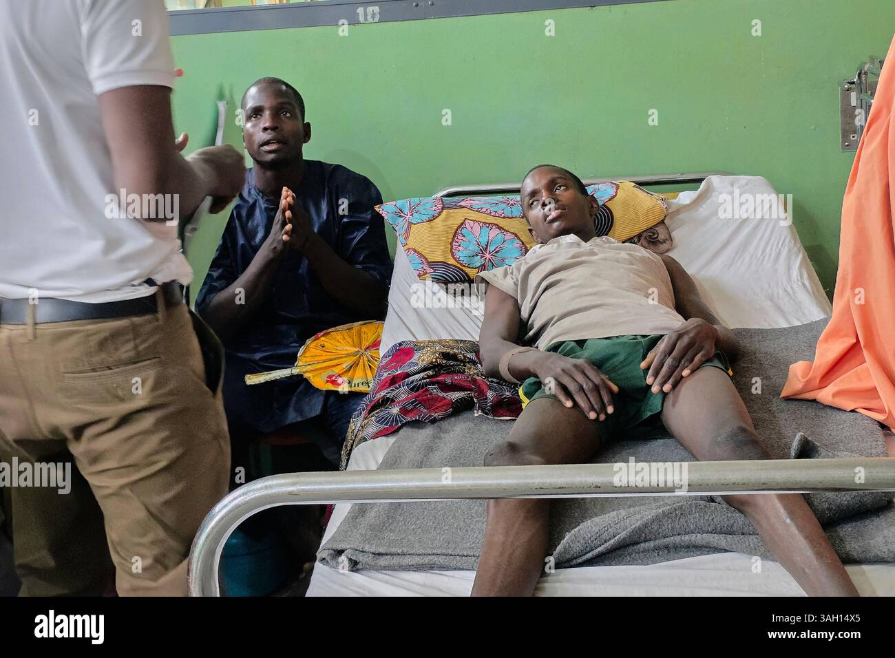 A patient suffering from meningitis receives treatment at the University teaching hospital in ...