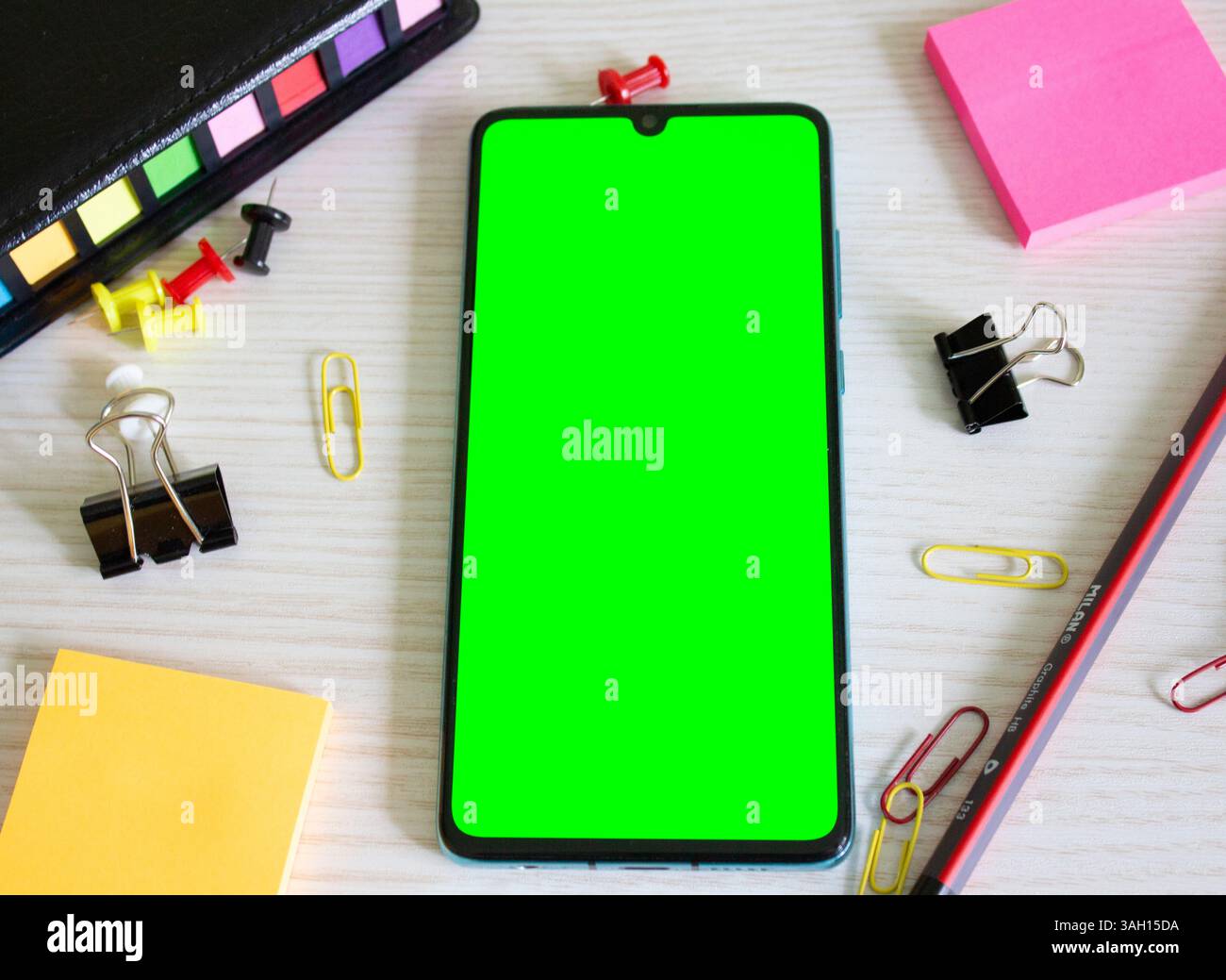 Top view, Smart phone on the table wooden background with green screen ...