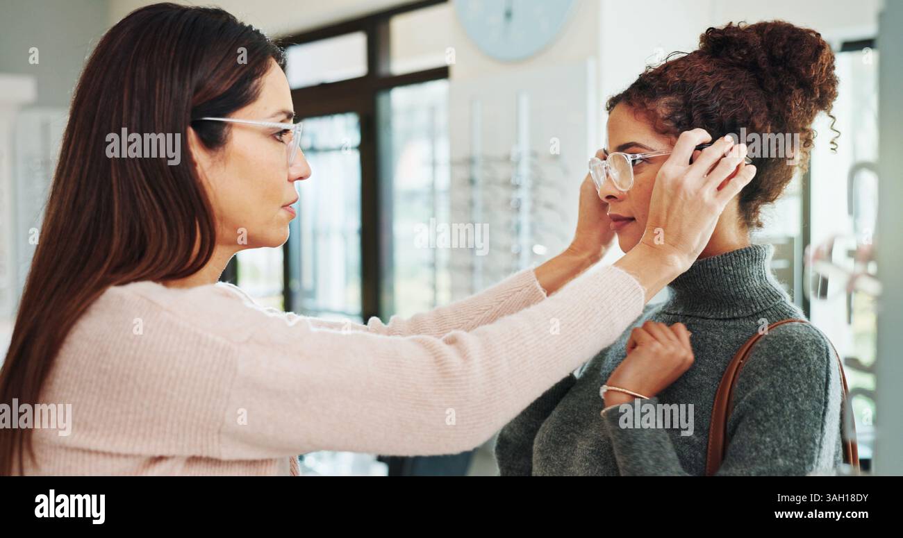 Shopping, woman and optician helping with glasses in optical store for frame fitting, eyewear ...