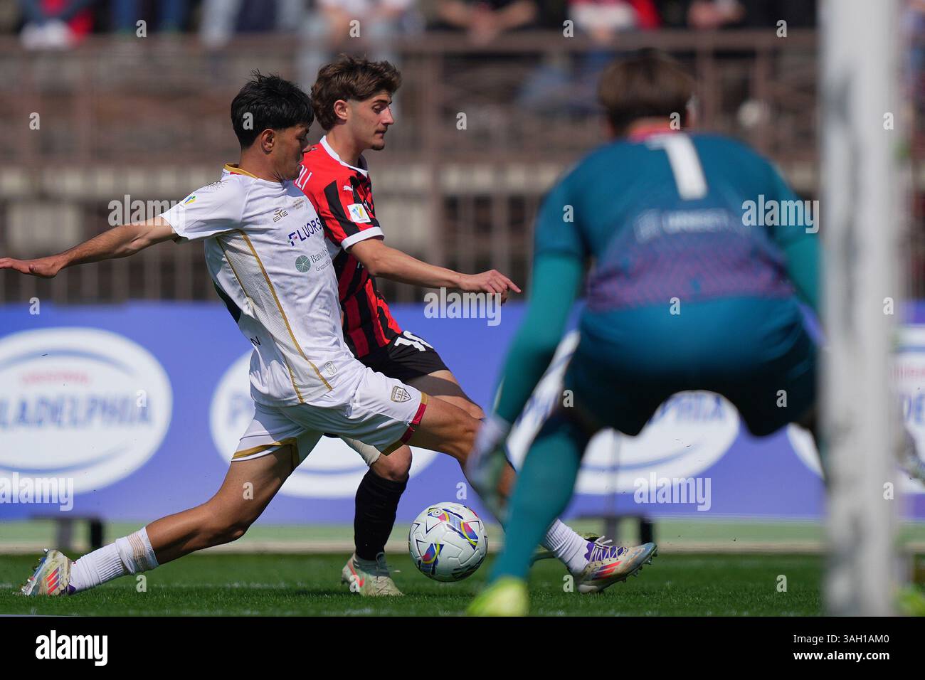Milano, Italia. 09th Apr, 2025. Mattia Liberali ( Ac Milan ) fights for the ball with Alessandro ...