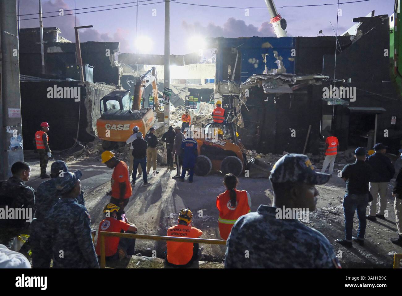 Rescue workers search for survivors at the Jet Set nightclub after its ...