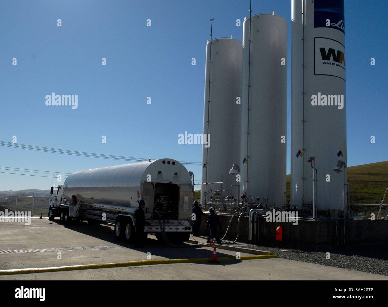 A tanker truck is filled with liquefied natural gas following the ...