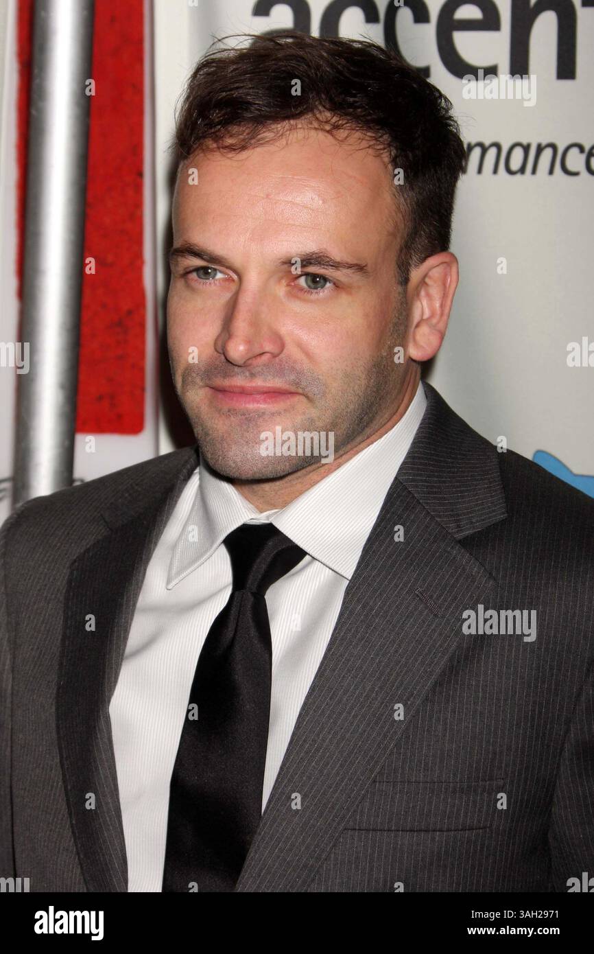 JONNY LEE MILLER arriving at the Only Make Believe 10th Anniversary ...