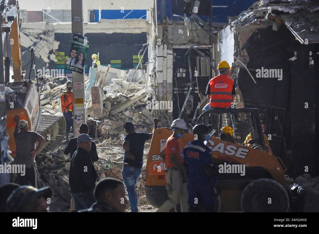Rescue workers search for survivors at the Jet Set nightclub after its ...