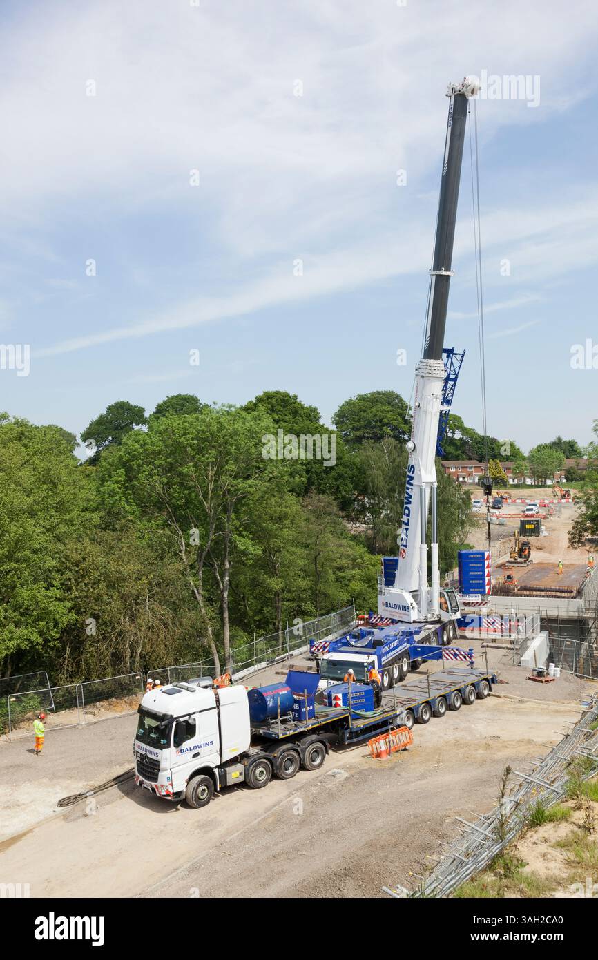 A heavy-lift Baldwins crane lifting concrete beams into place on a new ...