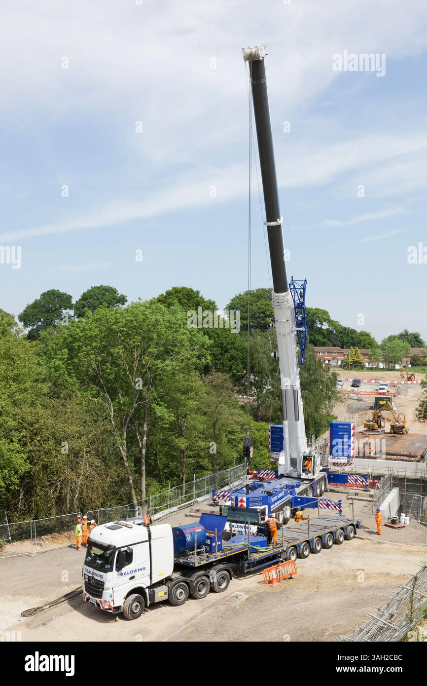 A heavy-lift Baldwins crane lifting concrete beams into place on a new ...