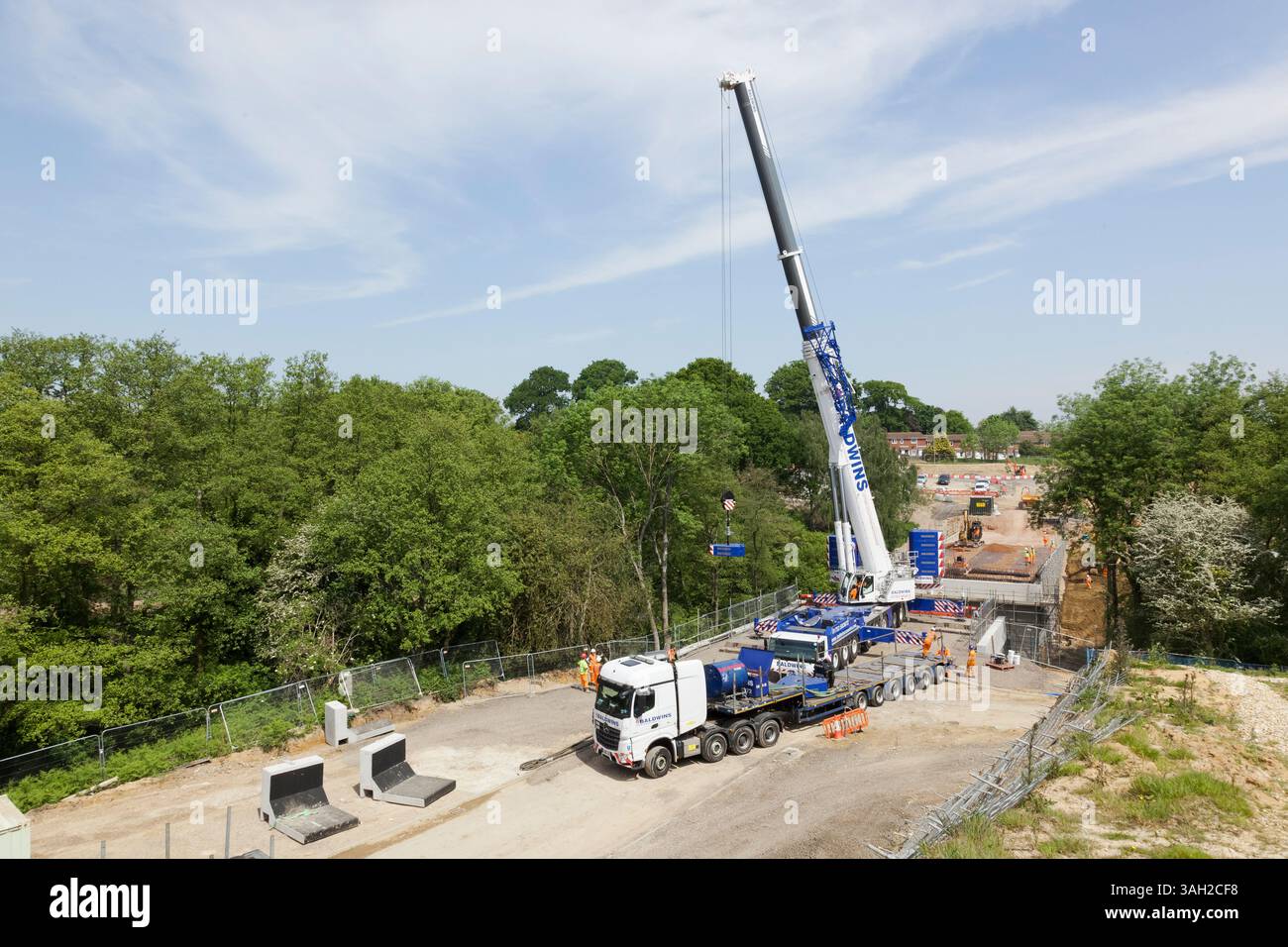 A heavy-lift Baldwins crane lifting concrete beams into place on a new ...