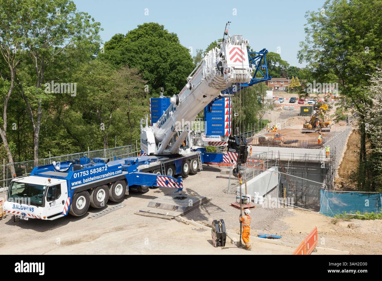 A heavy-lift Baldwins crane lifting concrete beams into place on a new ...