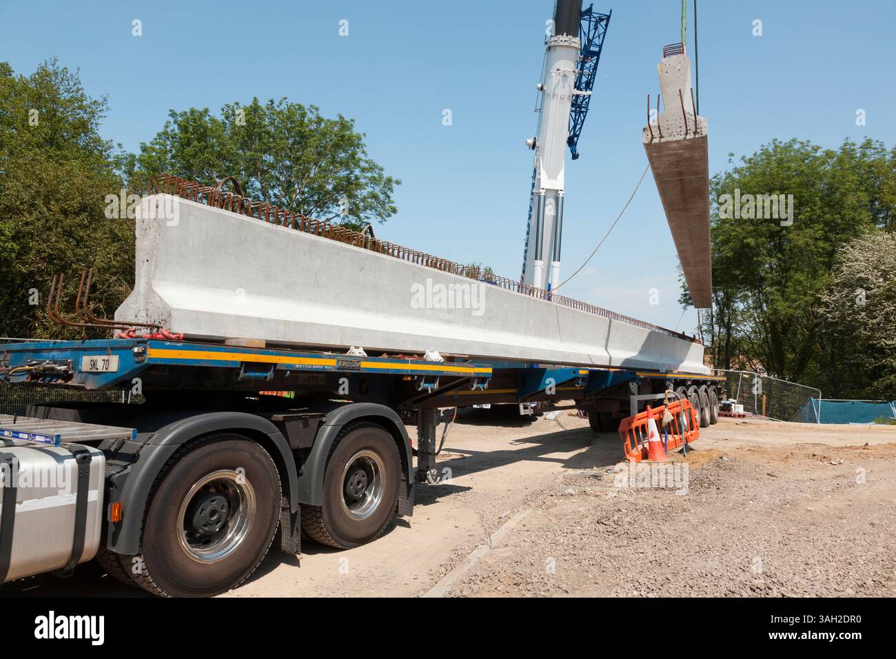 A heavy-lift Baldwins crane lifting concrete beams into place on a new ...