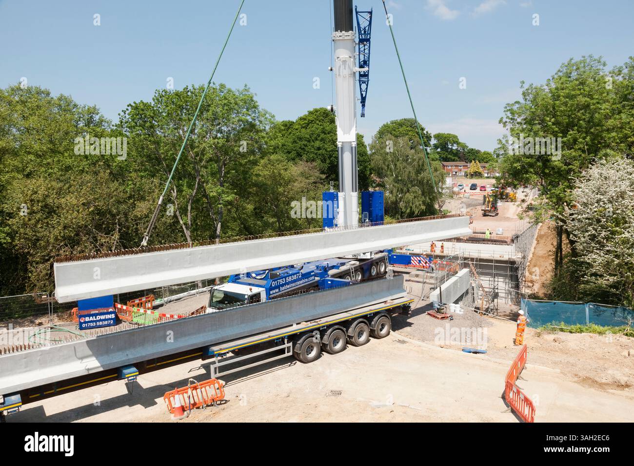 A heavy-lift Baldwins crane lifting concrete beams into place on a new ...