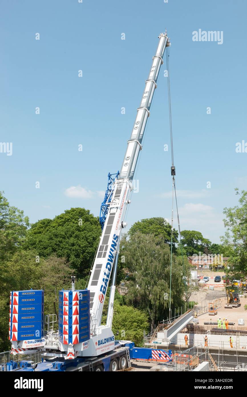A heavy-lift Baldwins crane lifting concrete beams into place on a new ...