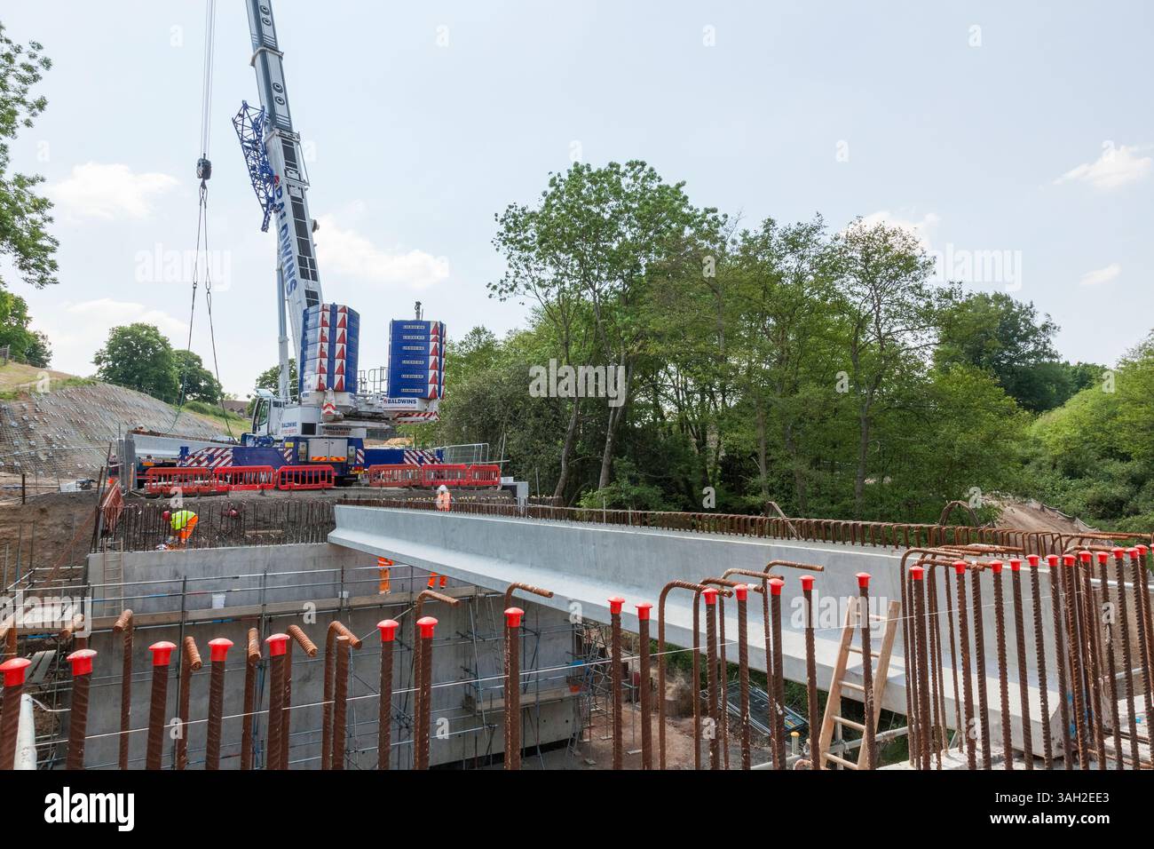A heavy-lift Baldwins crane lifting concrete beams into place on a new ...