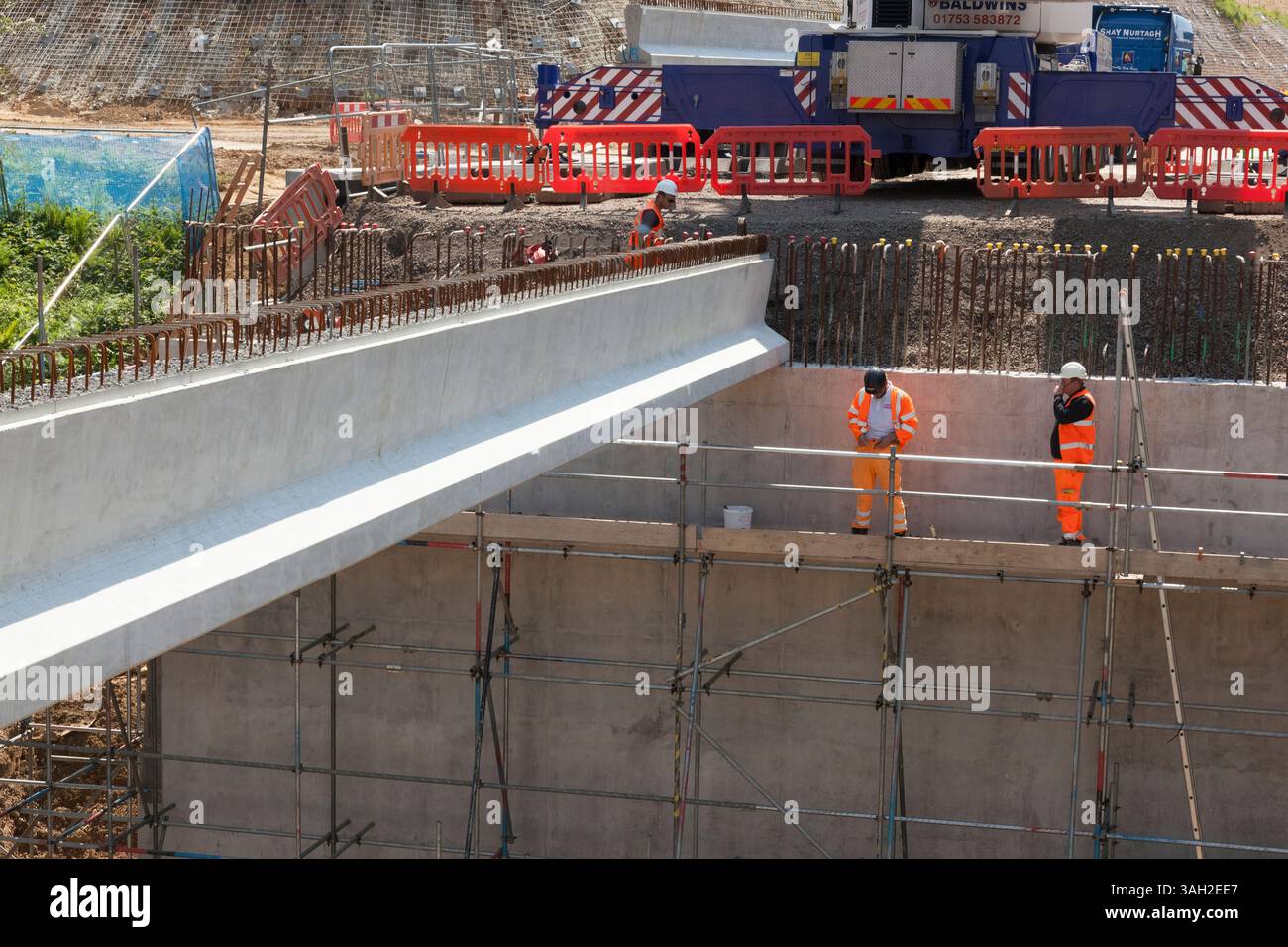 A heavy-lift Baldwins crane lifting concrete beams into place on a new ...