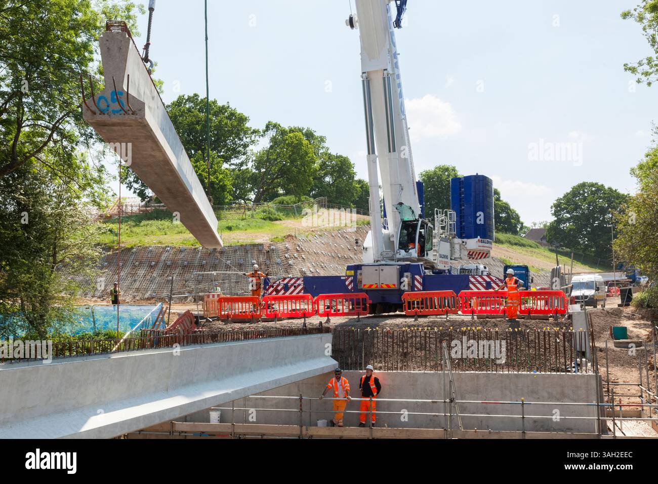 A heavy-lift Baldwins crane lifting concrete beams into place on a new ...