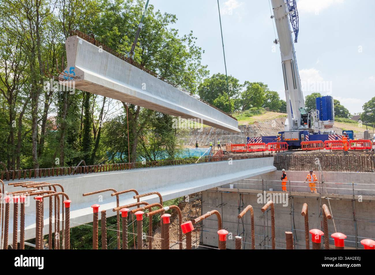 A heavy-lift Baldwins crane lifting concrete beams into place on a new ...