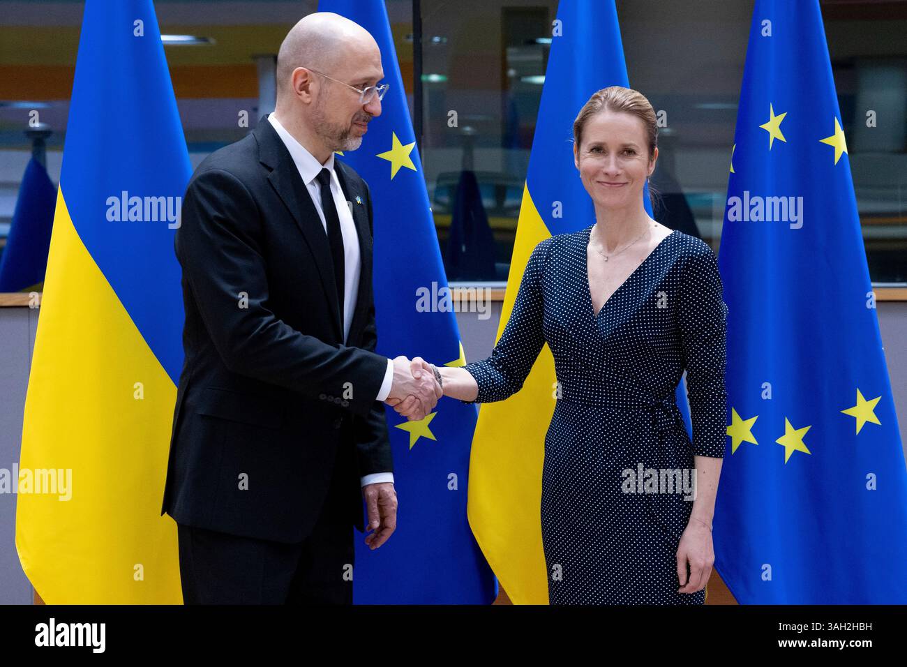 European Union foreign policy chief Kaja Kallas, right, shakes hands ...