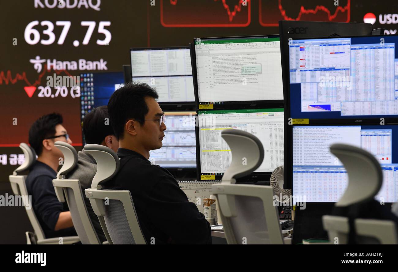 Stock market plummet in South Korea A currency traders reacts at the ...