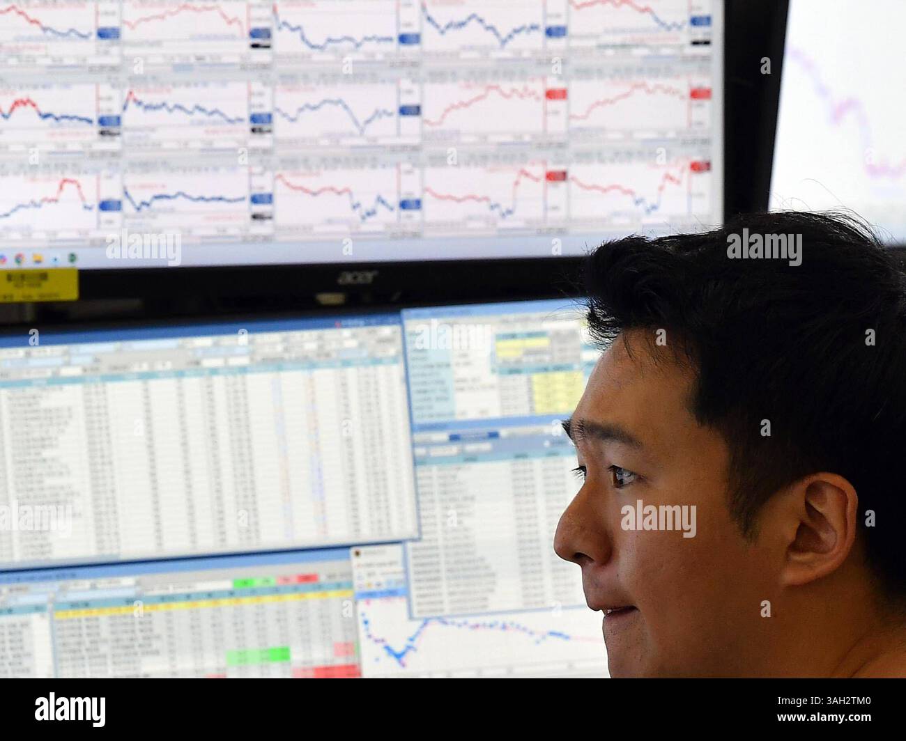 Stock market plummet in South Korea A currency trader works at the ...