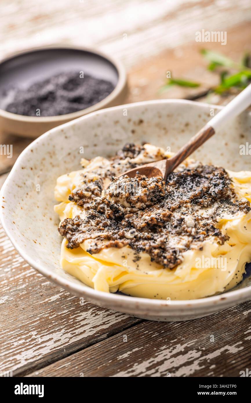 Homemade truffle butter with olive oil and black salt Stock Photo - Alamy