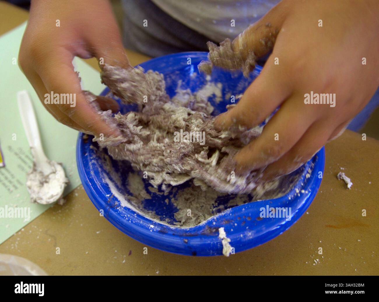 Student mixes ingrediance to make clay and eventually used to build a ...