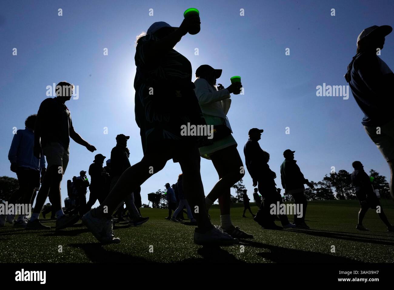 Patrons arrive for a practice around at the Masters golf tournament ...