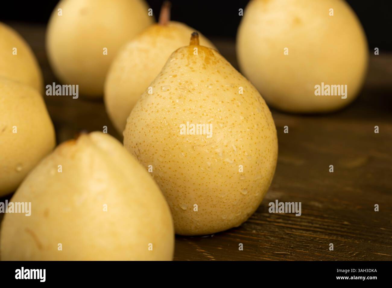 ripe pears with light skins, sweet pears of white color with spots on ...
