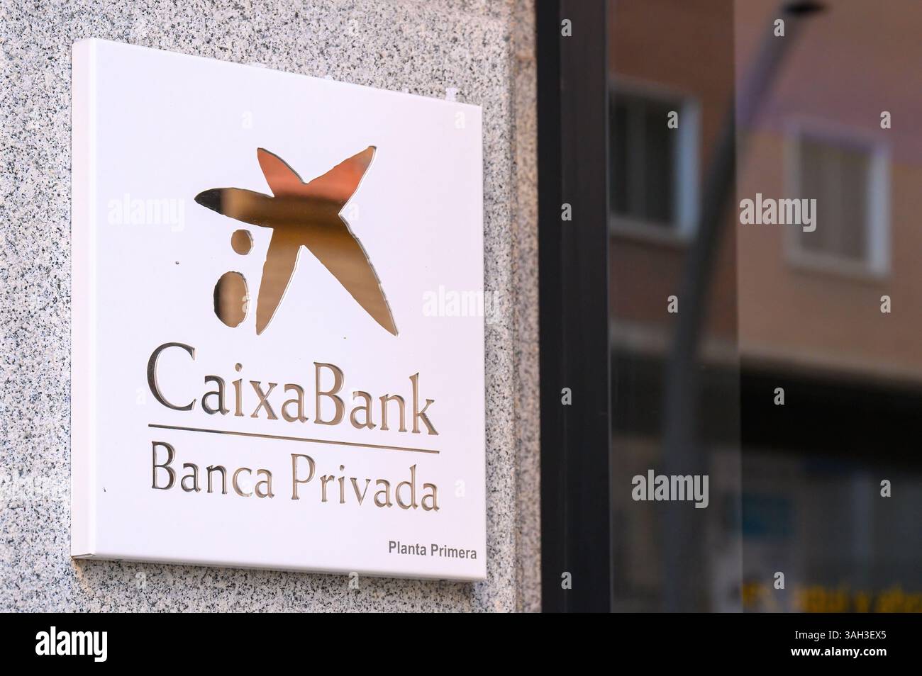 Sign with the Caixa Bank logo on a building column Stock Photo - Alamy