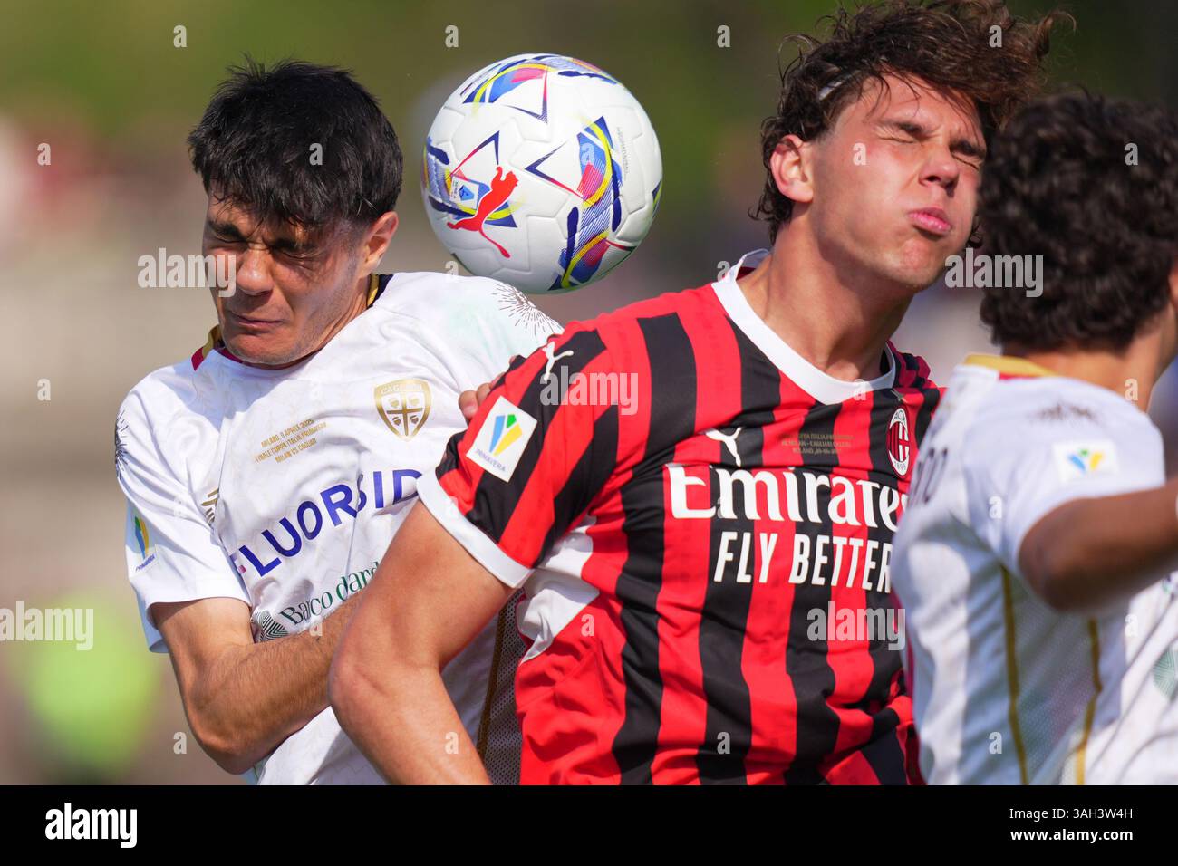 Cagliari's andrea cogoni fights for the ball with AC MilanÕs matteo ...