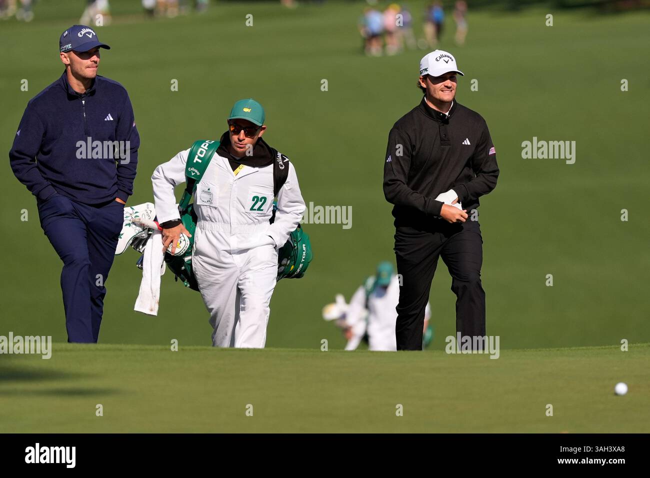 Rasmus Hojgaard, right, and Nicolai Hojgaard walk to the green on the ...