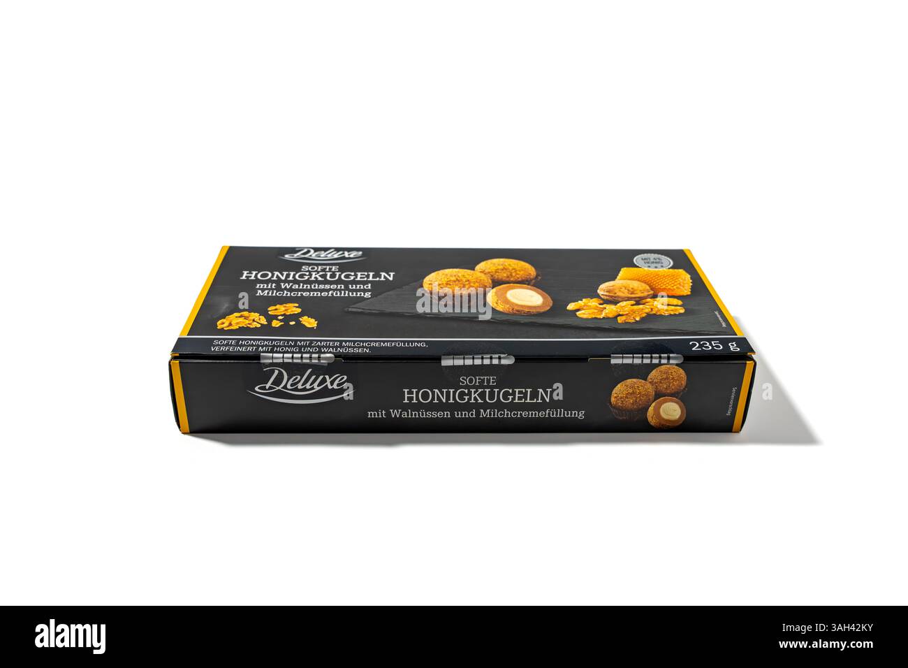 Germany Berlin April 9, 2025. Black box of honey balls candies isolated ...