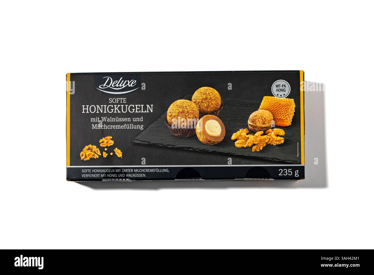 Germany Berlin April 9, 2025. Black box of honey balls candies isolated ...