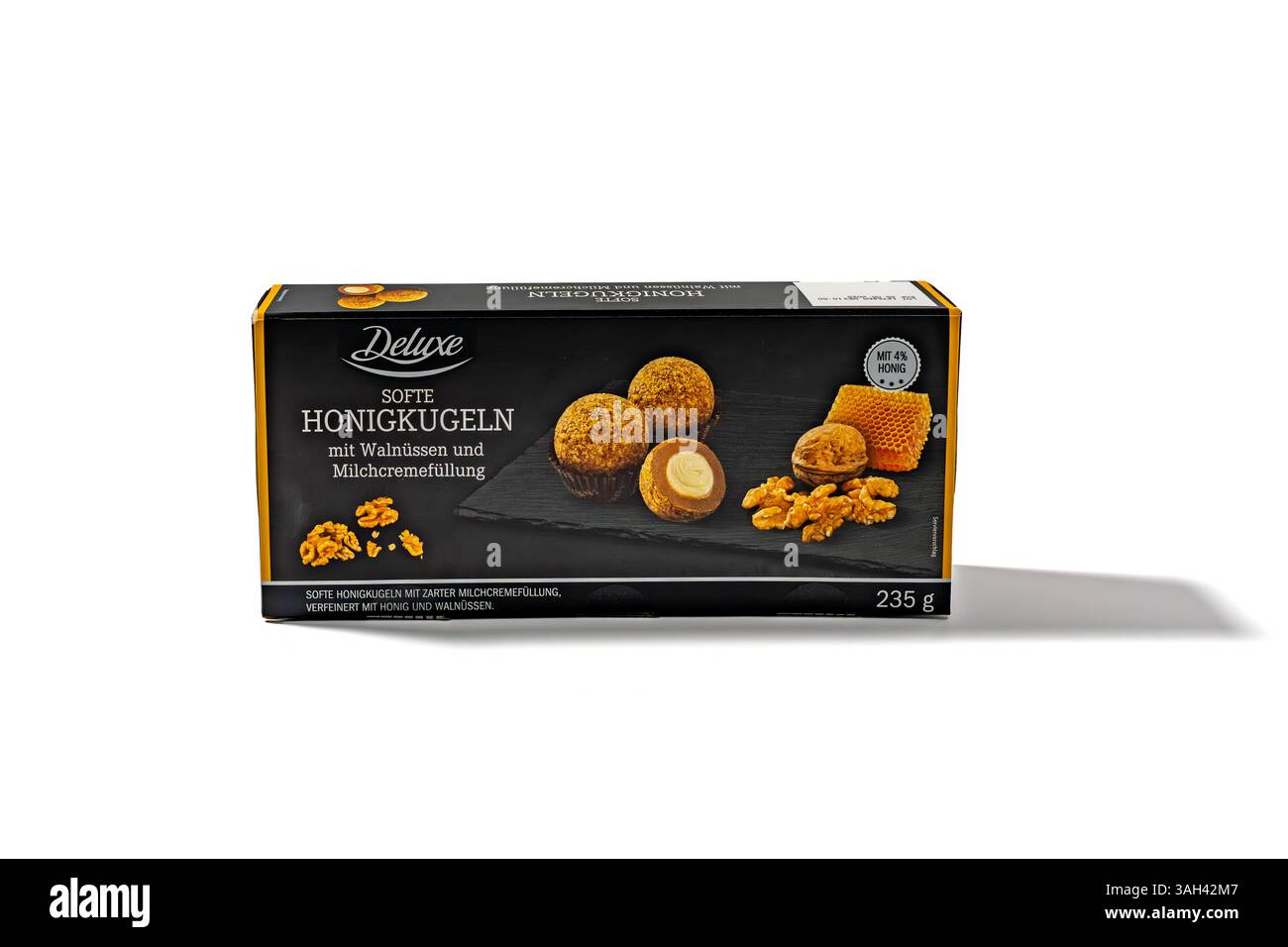 Germany Berlin April 9, 2025. Black box of honey balls candies isolated ...