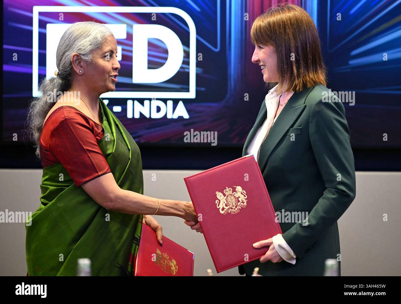Chancellor of the Exchequer Rachel Reeves shakes hands with the Finance ...