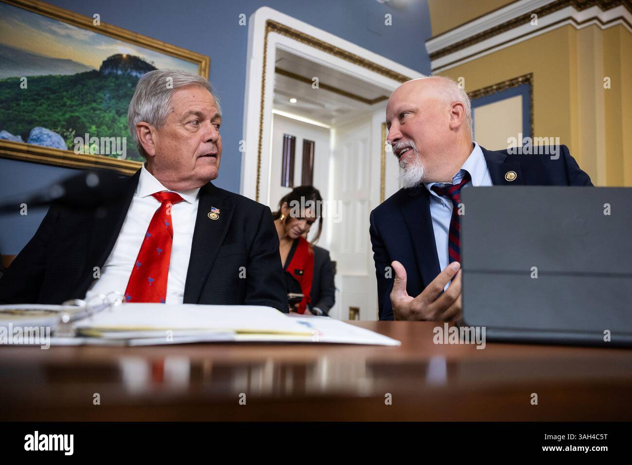 Reps. Ralph Norman (R-S.C.) and Chip Roy (R-Texas) confer during a ...