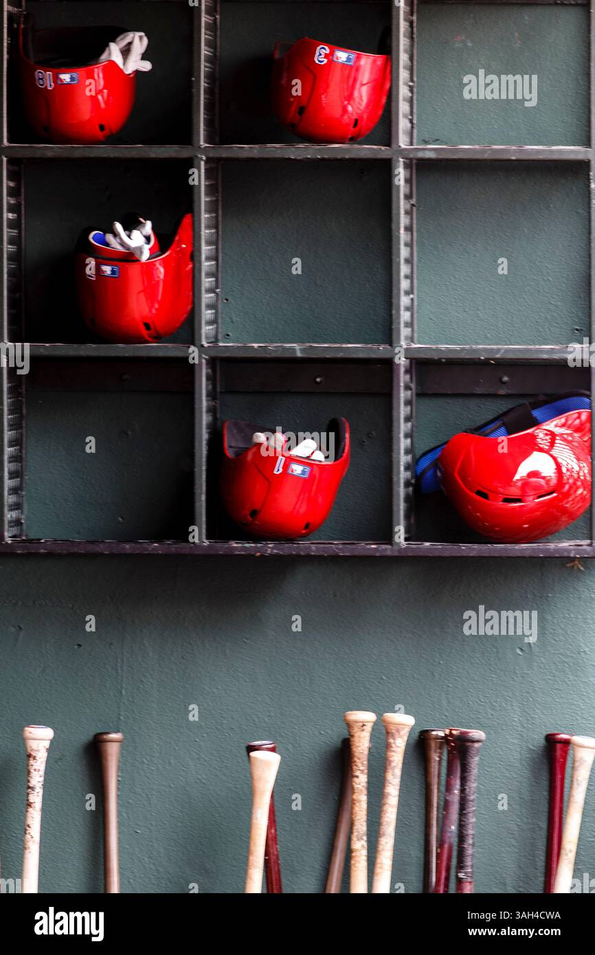 April 10, 2015: Texas Rangers batting helmets and bats in the dugout ...