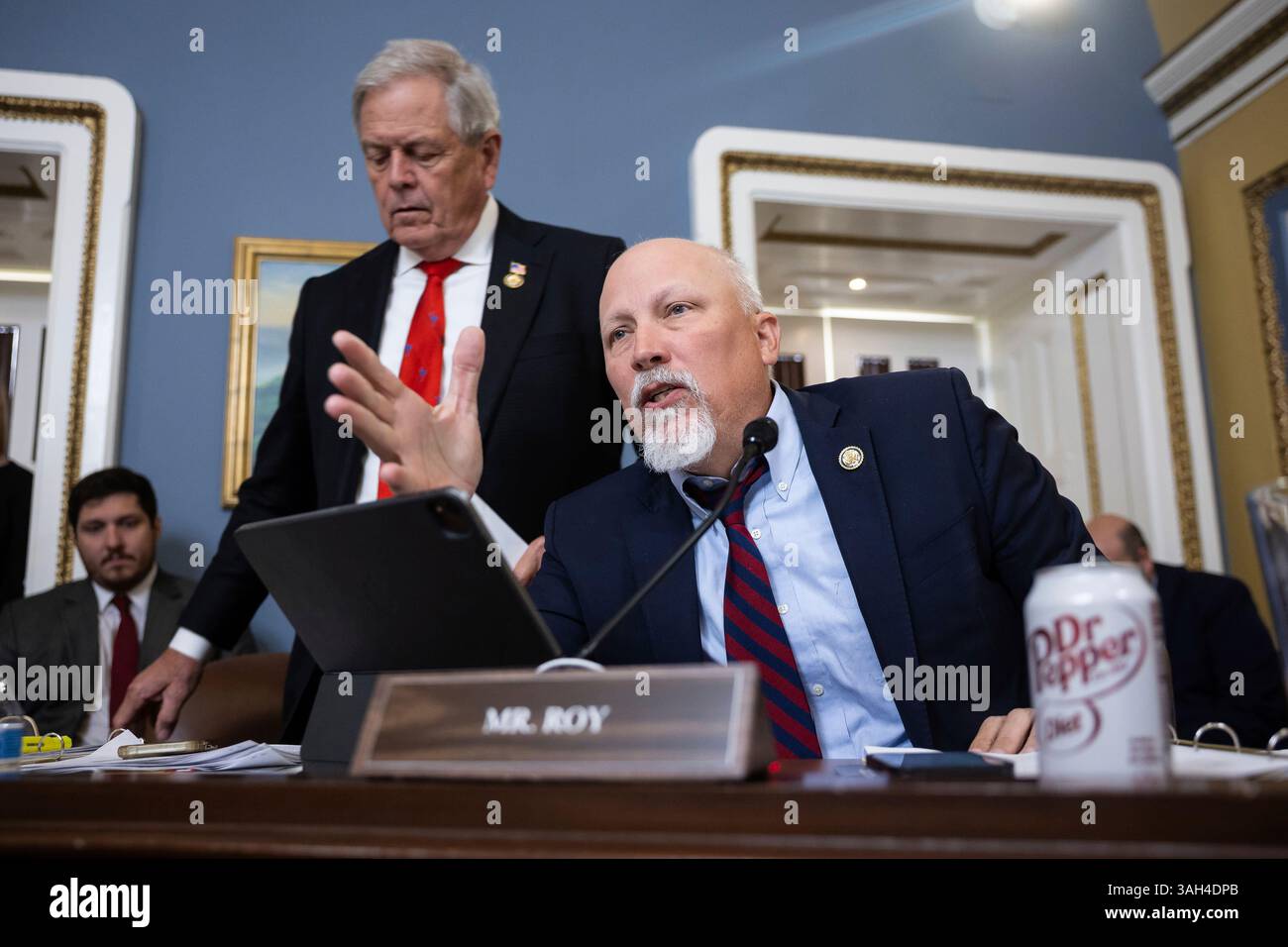 Rep. Chip Roy (R-Texas) speaks while Rep. Ralph Norman (R-S.C.) takes ...