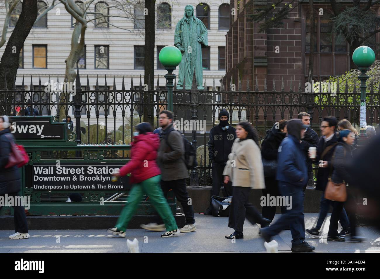 Commuters exit the Wall Street subway station near the New York Stock ...